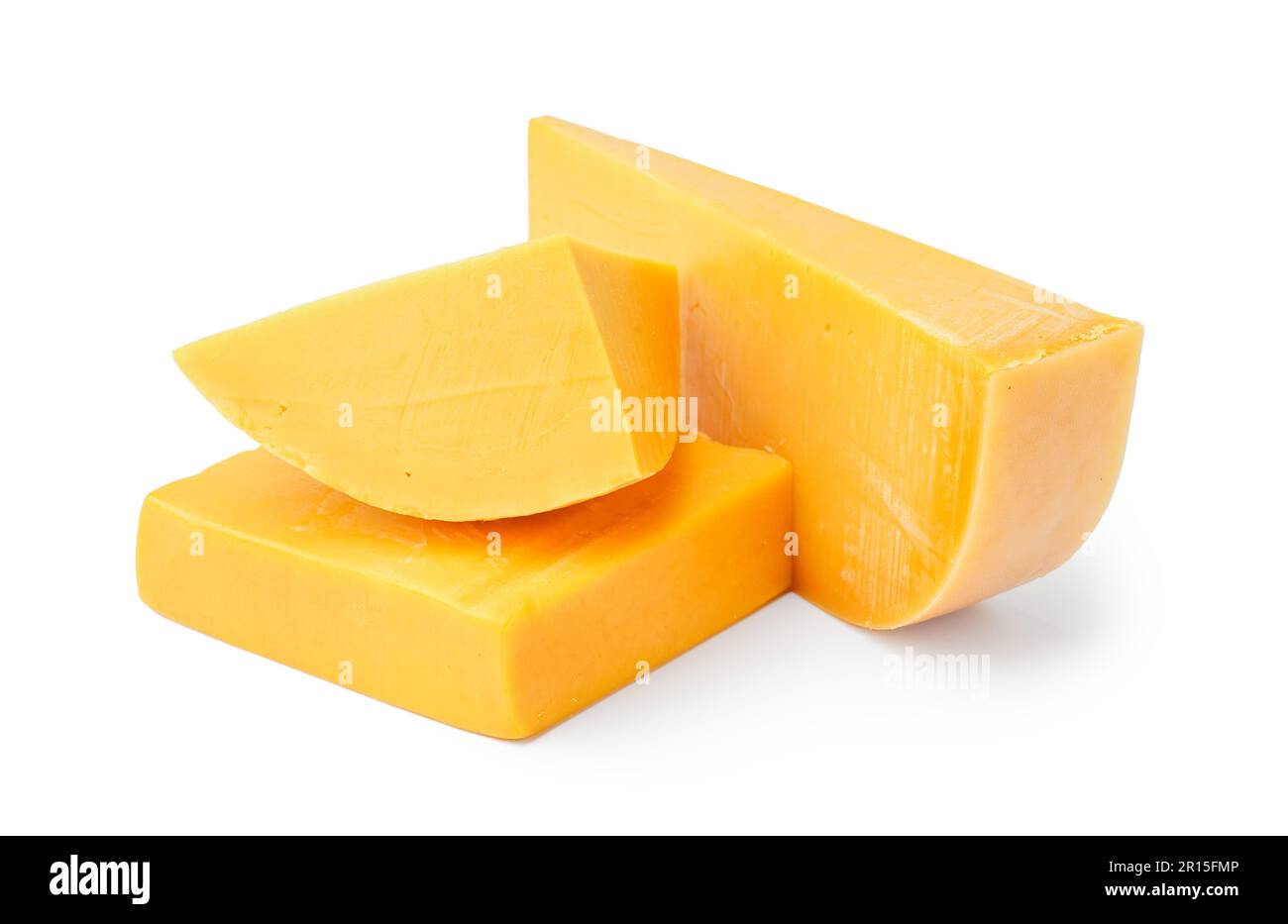 Pieces of tasty cheddar cheese on white background Stock Photo - Alamy