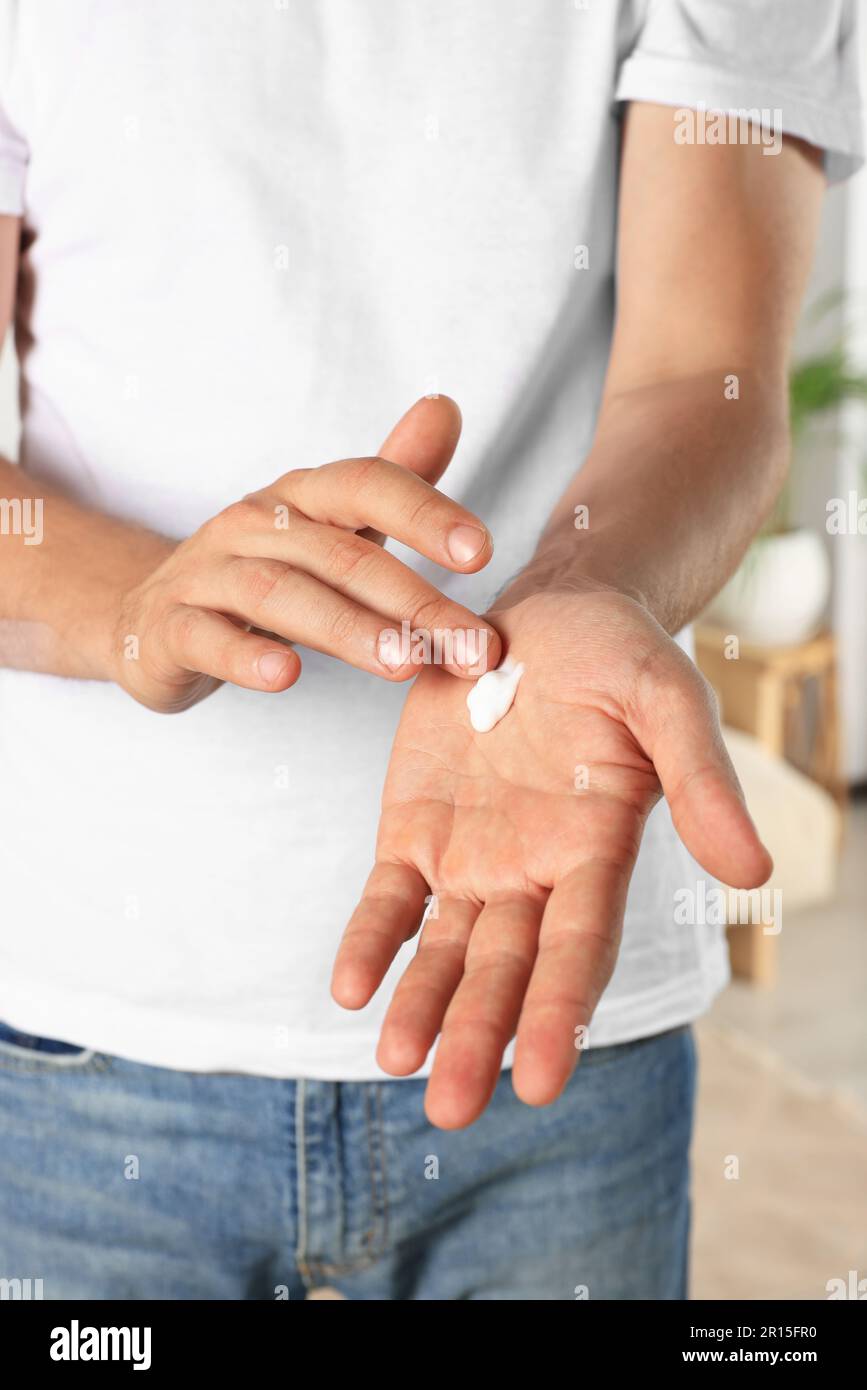 Man skin cream arms hi-res stock photography and images - Alamy