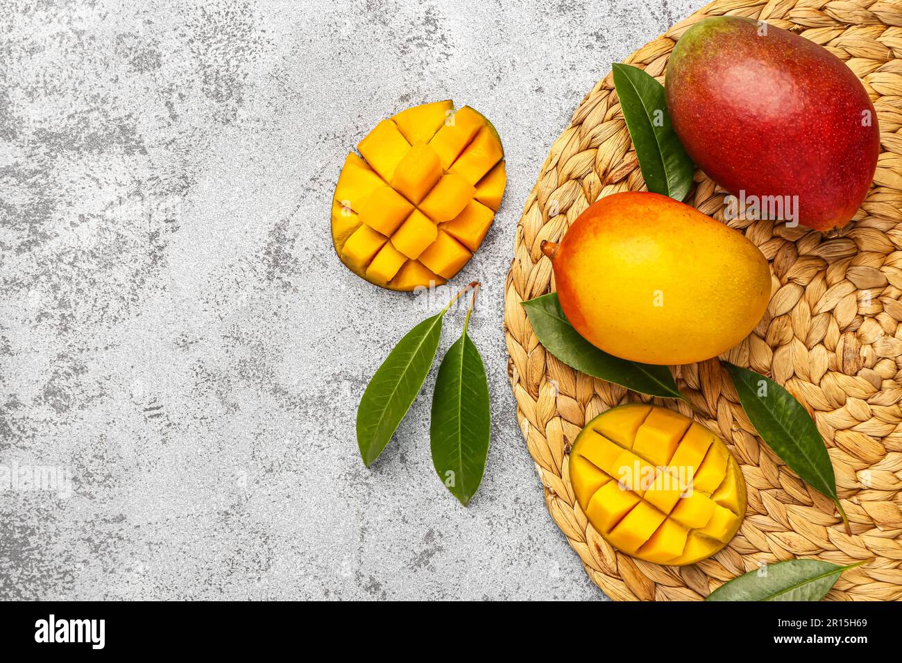 Fresh ripe mangoes on grunge background Stock Photo - Alamy