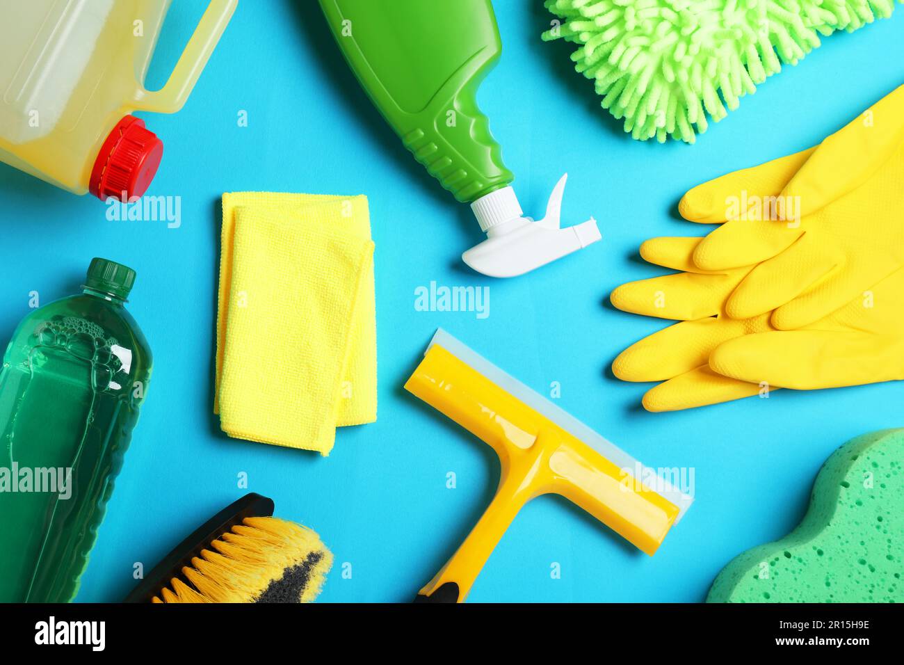 Flat lay composition with different car wash products on light blue ...