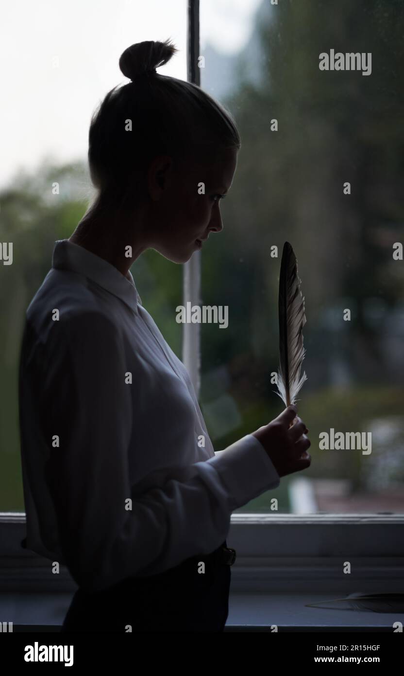 Let your imagination take flight. profile of a woman standing by a ...