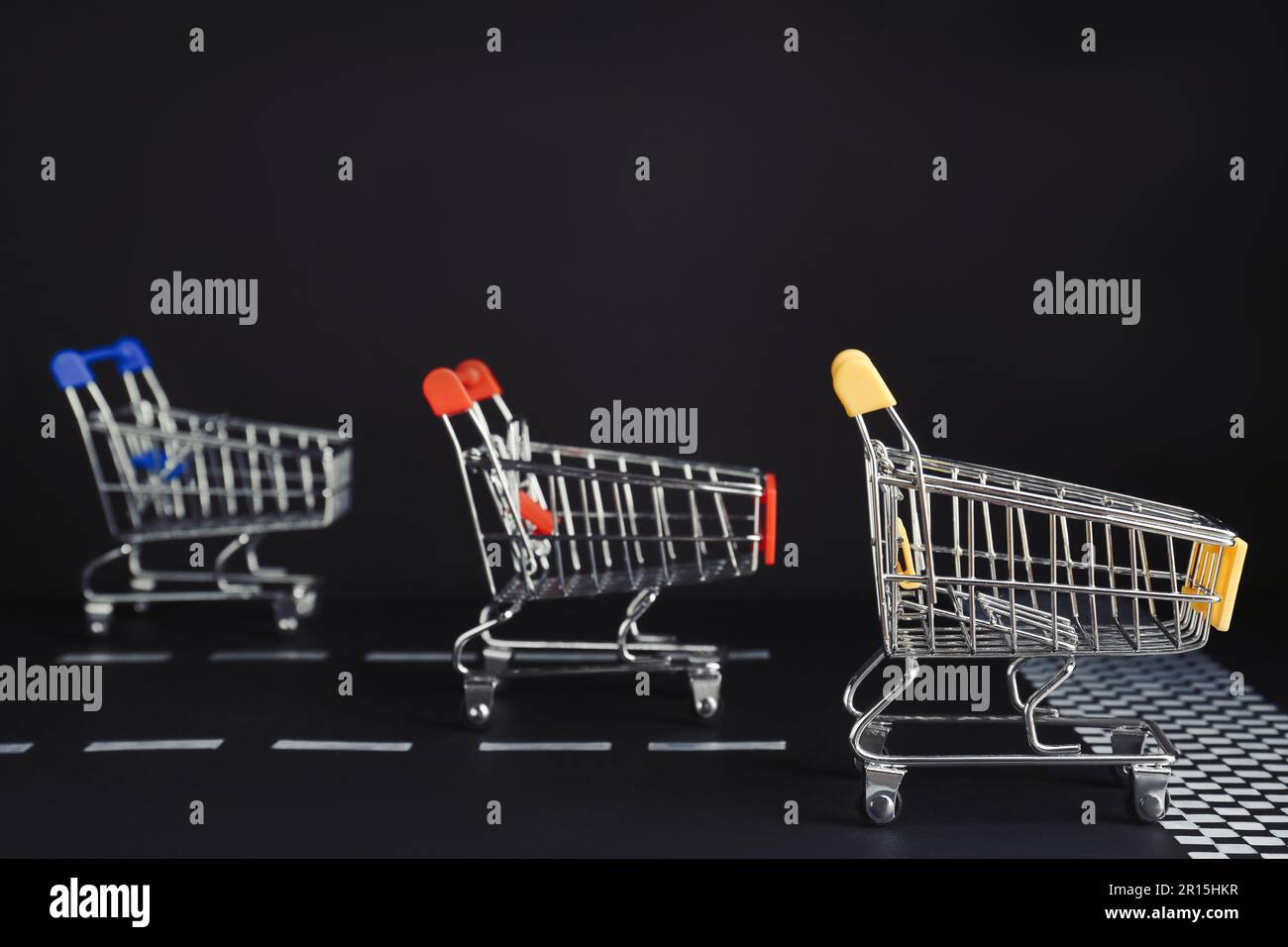 Competition concept. Shopping carts racing towards finish line Stock ...