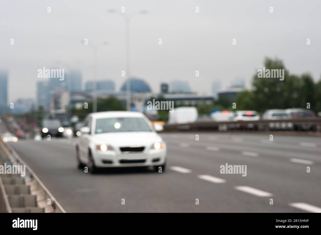 Blurred view of city road with cars Stock Photo - Alamy