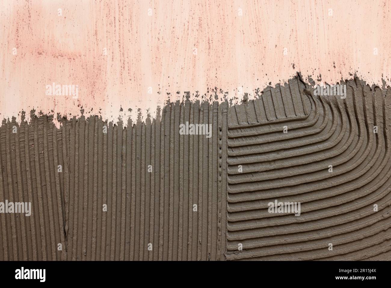 Adhesive mix for tile installation on wall, closeup Stock Photo - Alamy
