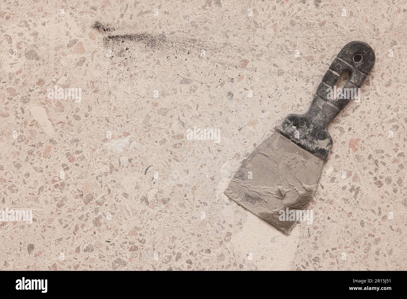 Metal spatula on floor, top view with space for text. Tiles ...