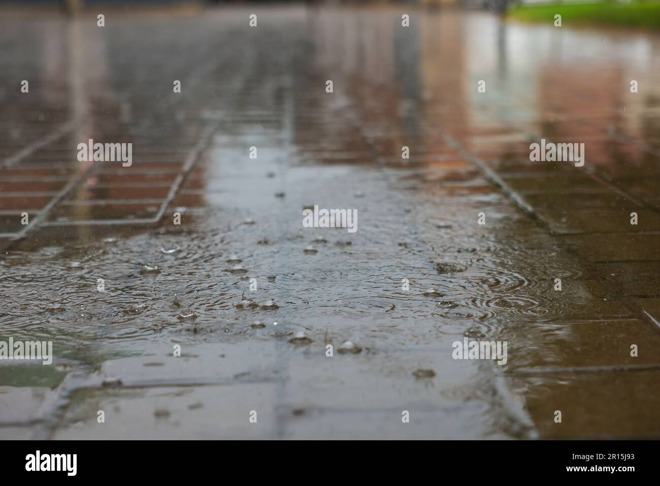 Rain puddles on street raindrops hi-res stock photography and images ...