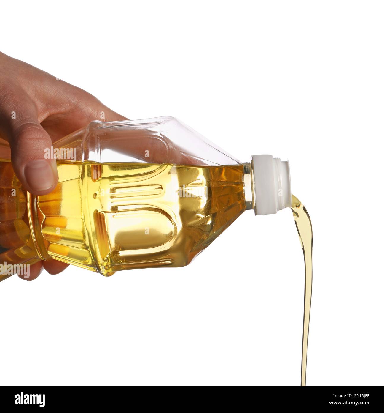 Pouring cooking oil from bottle on white background Stock Photo - Alamy