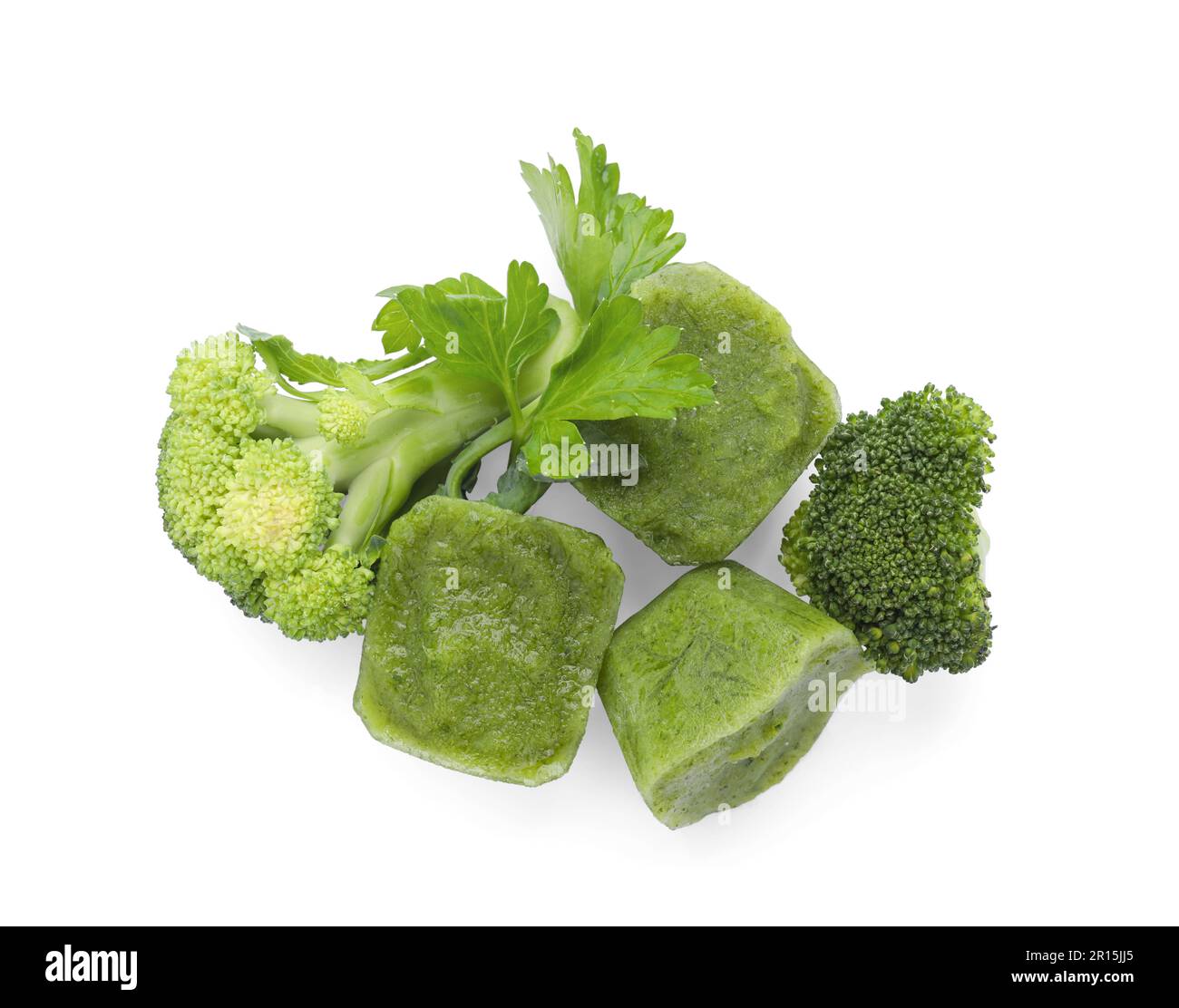 Frozen broccoli puree cubes and fresh broccoli isolated on white, top ...