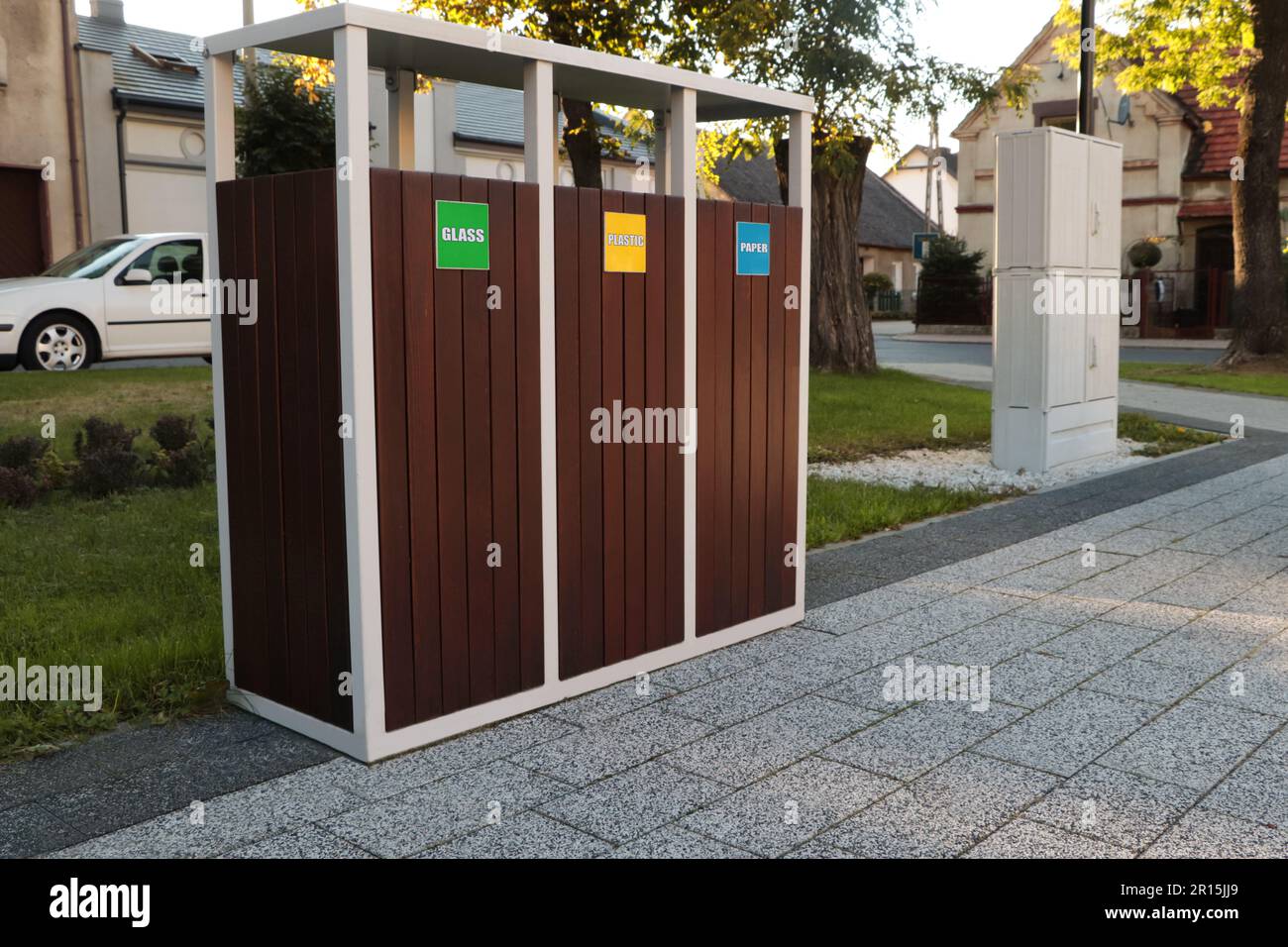 Different sorting bins for waste recycling on city street outdoors ...