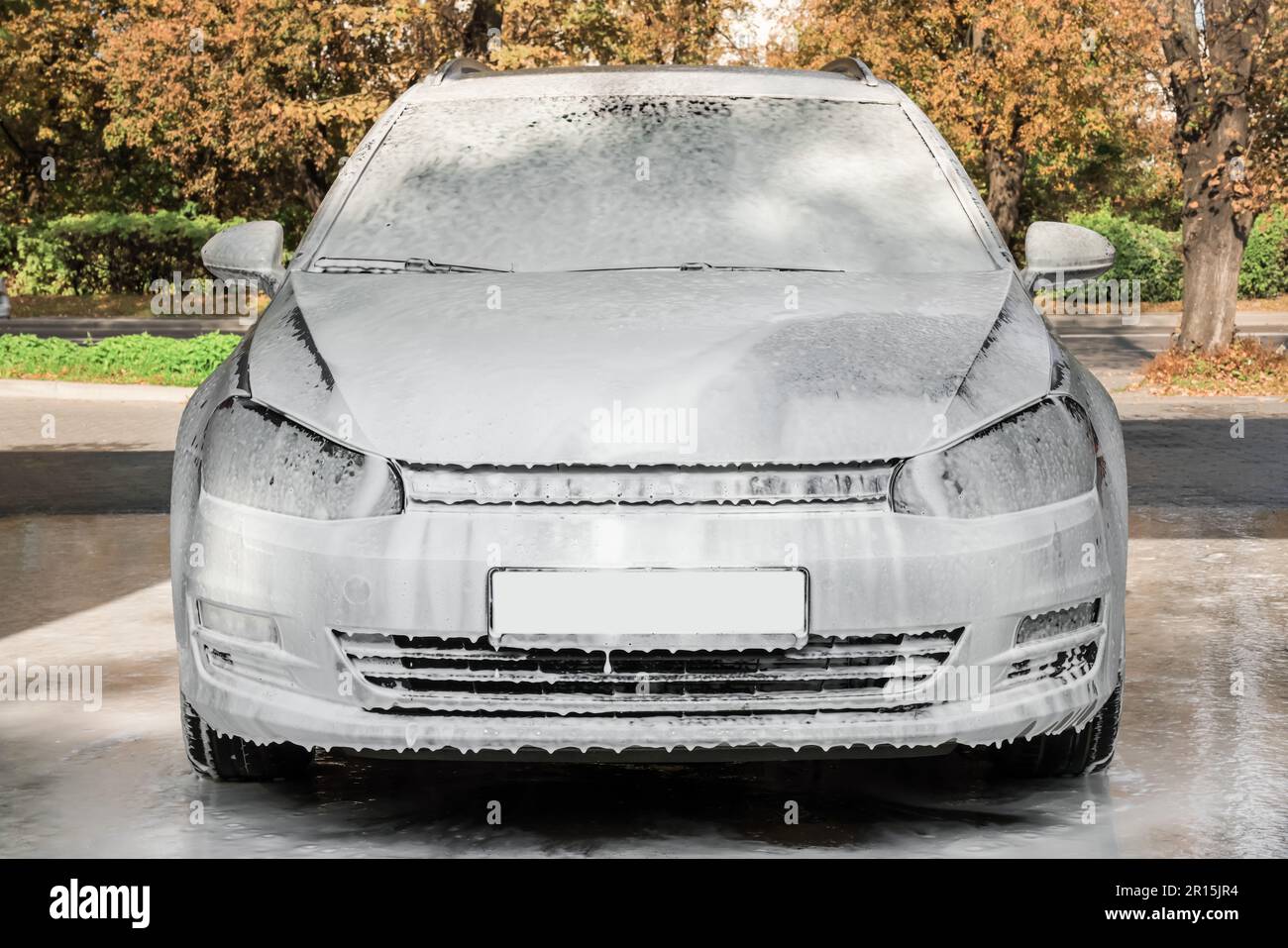 Auto with cleaning foam at outdoor car wash Stock Photo - Alamy