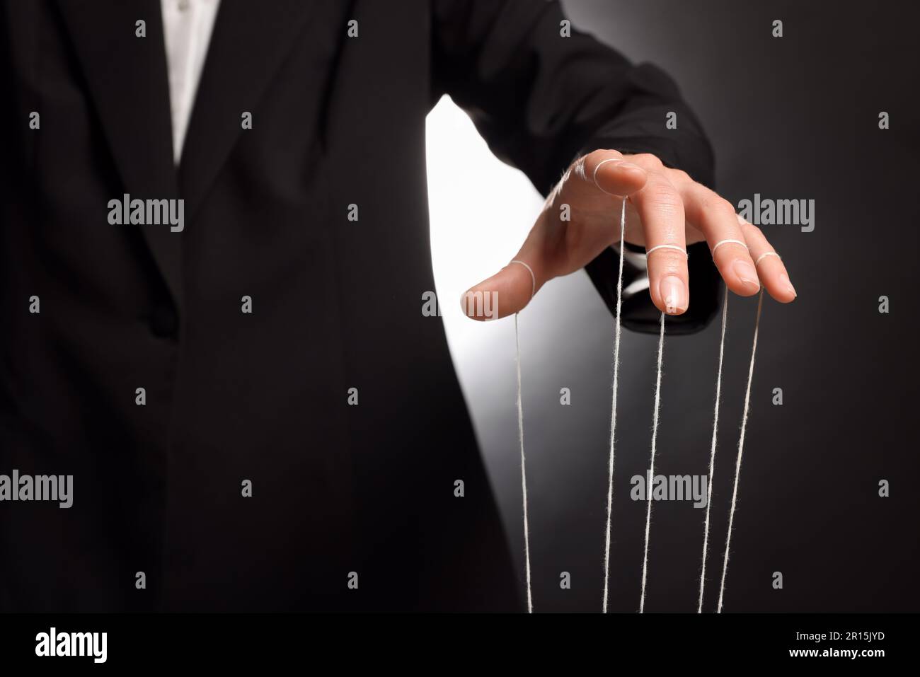 Woman holding puppet on string hi-res stock photography and images - Alamy