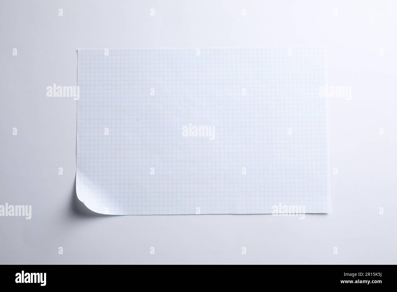 Checkered sheet of paper on white background, top view Stock Photo - Alamy