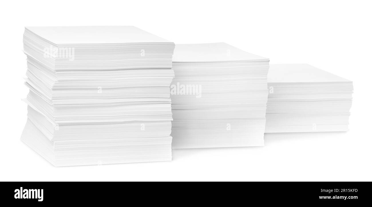 Stacks of paper sheets on white background Stock Photo - Alamy