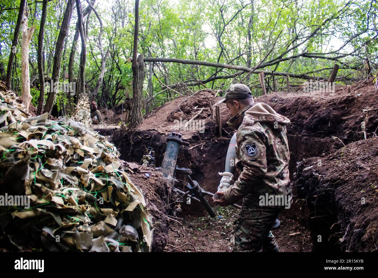 Ukrainian soldier from the 28th Artillery Battalion firing a 120mm ...
