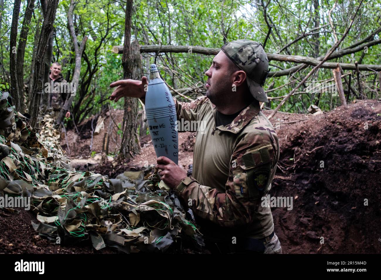 Ukrainian soldier from the 28th Artillery Battalion firing a 120mm ...