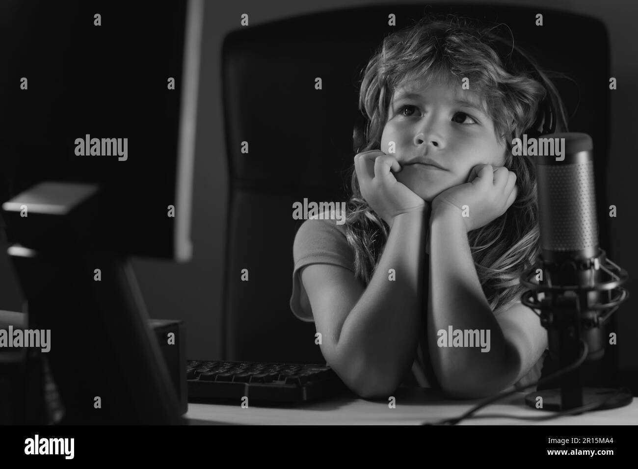 Child with pc computer at night. School, study, online learning concept ...