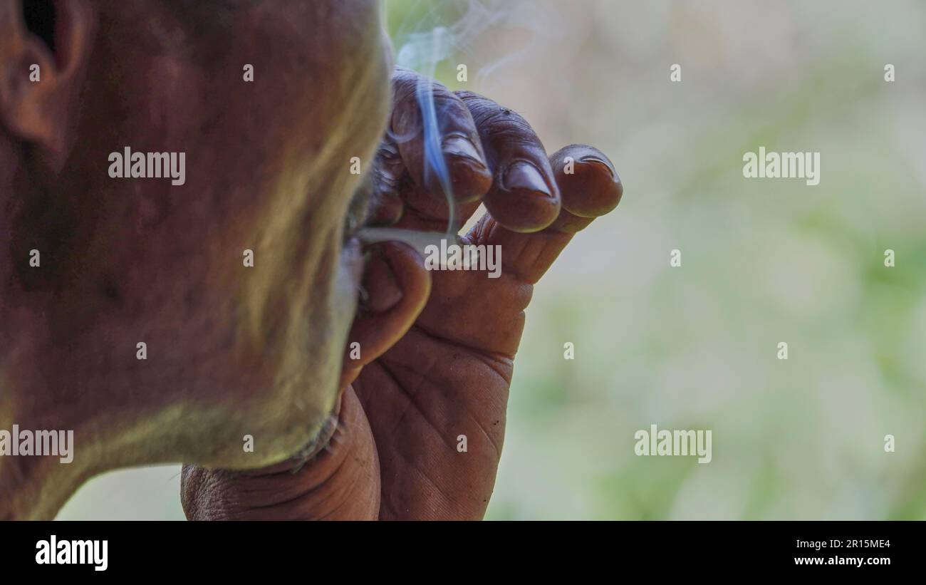 Close up a person smoking a cigarette from tobacco Stock Photo - Alamy