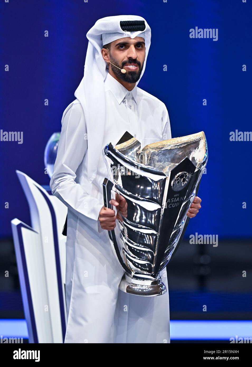 Doha. 11th May, 2023. Qatari footballer Hassan al-Haydos carries the ...