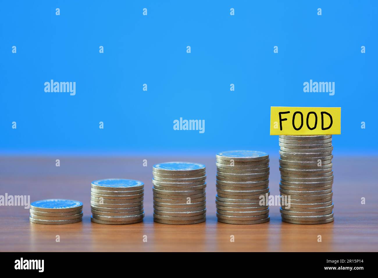 A row of a growing stack of coins illustrating the increasing cost of ...