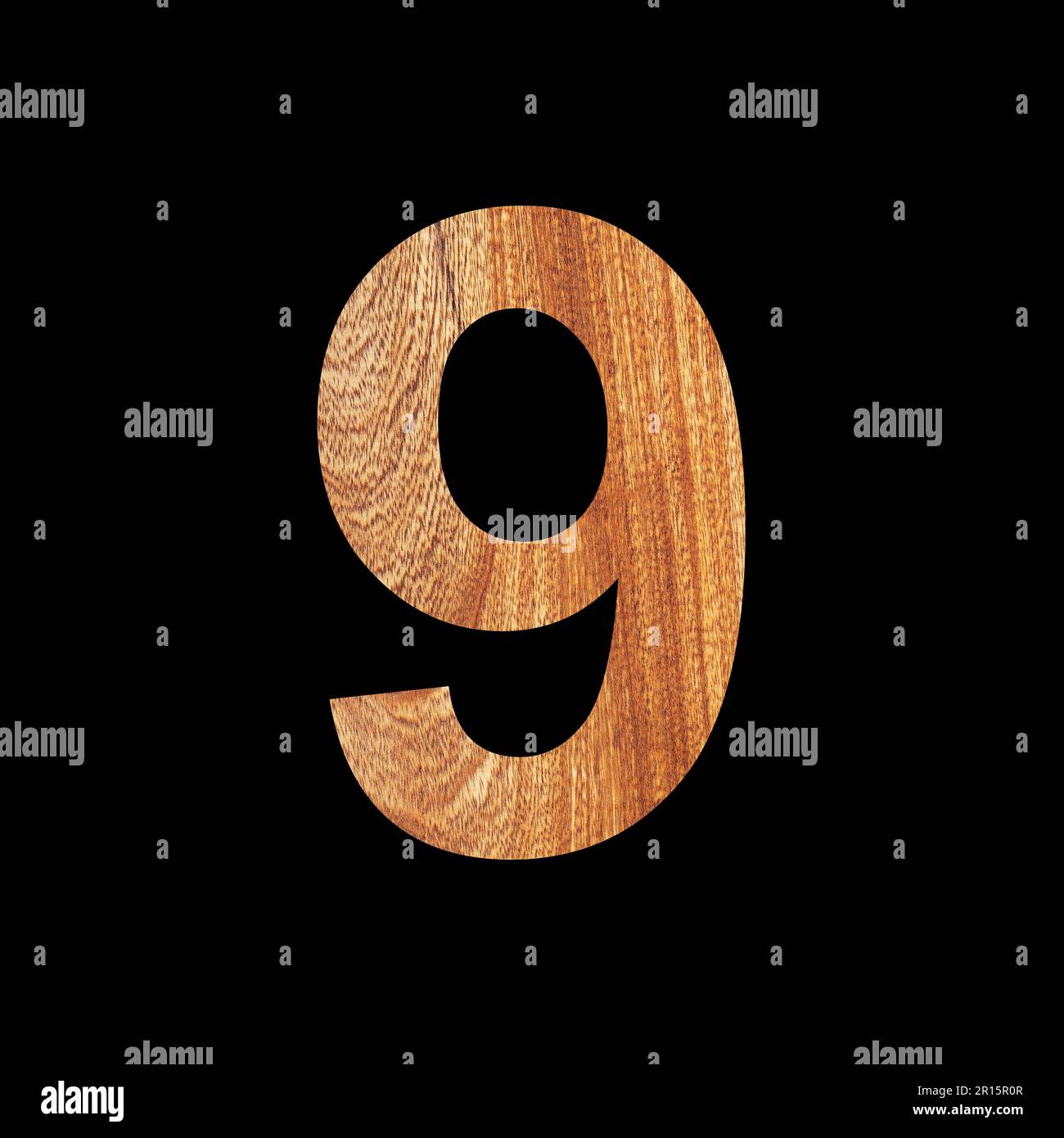Number nine - The 9 in oak wood. Black background Stock Photo - Alamy