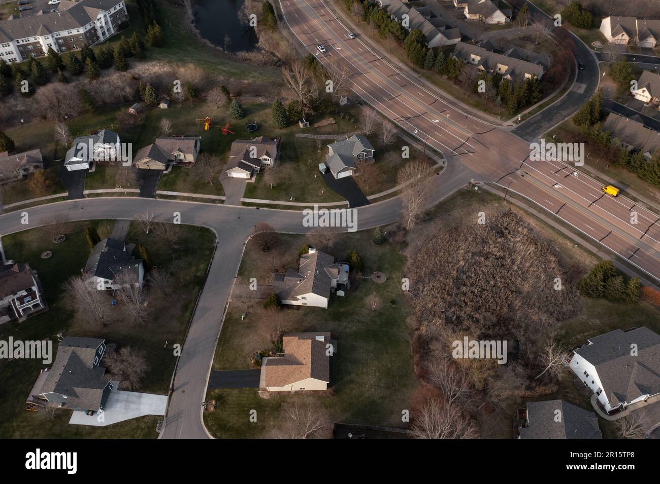 Multi Lane Road Passes Through Residential Area - drone aerial Stock ...
