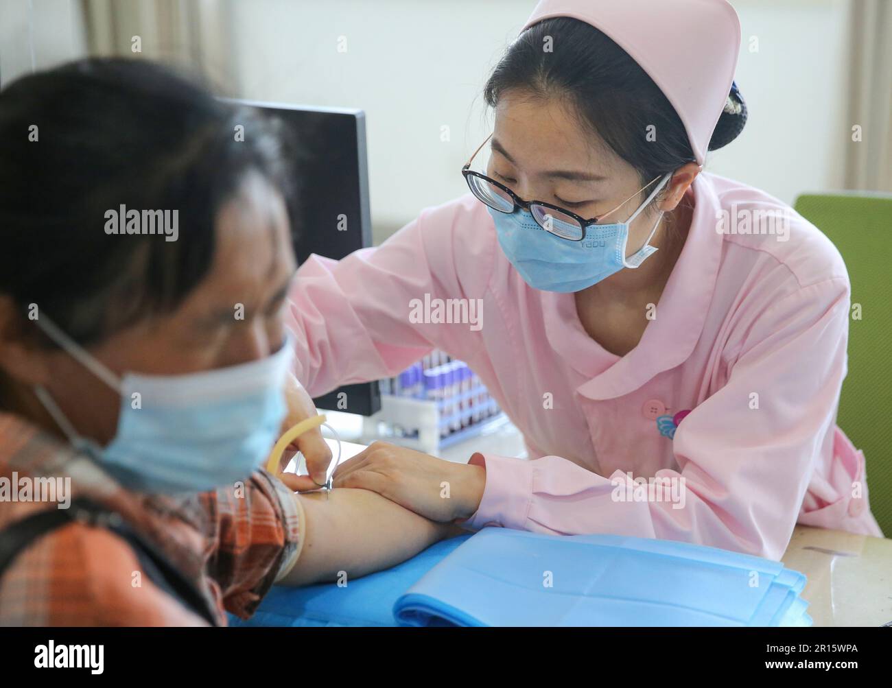 LIANYUNGANG, CHINA - MAY 12, 2023 - Nurse Li Zhaozhao draws a blood sample for a medical ...