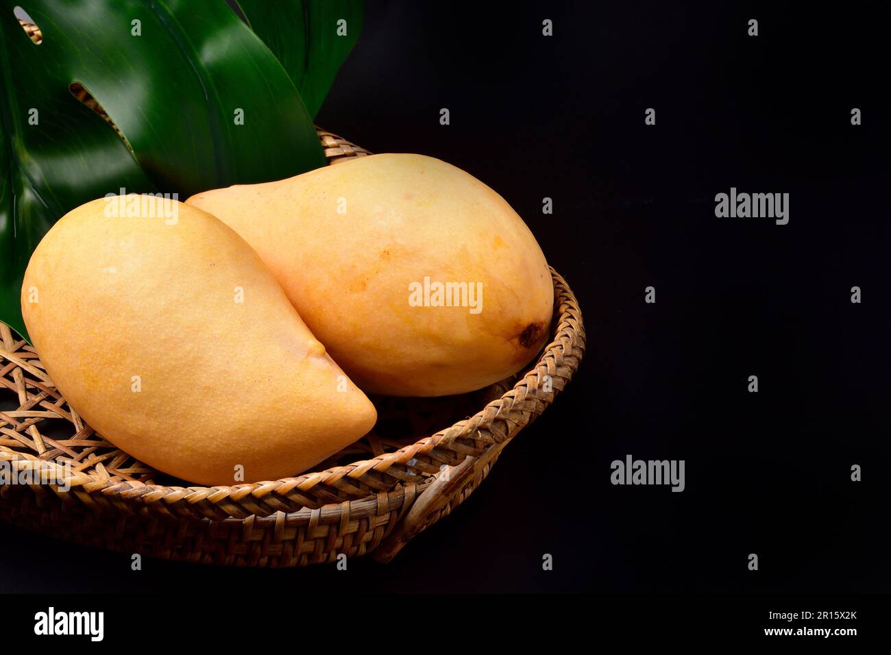 Mango on basket hi-res stock photography and images - Alamy