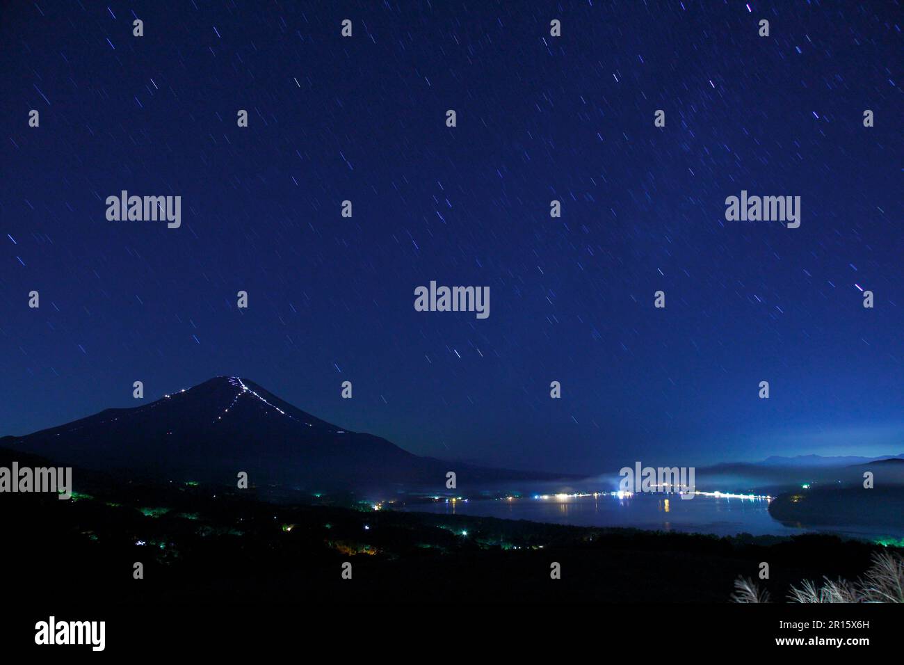 Mt. Fuji, starry sky, and Lake Yamanaka at night Stock Photo - Alamy