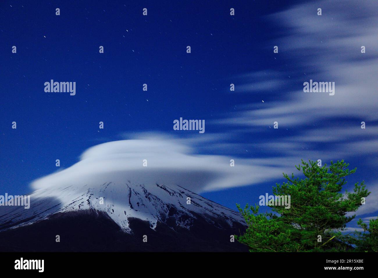 Cap clouds and Mount Fuji at night Stock Photo - Alamy