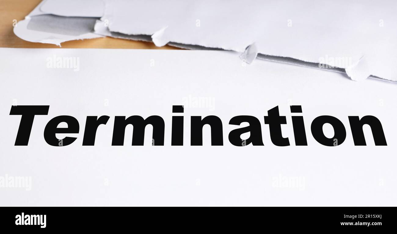 termination letter with opened envelope on desk Stock Photo - Alamy