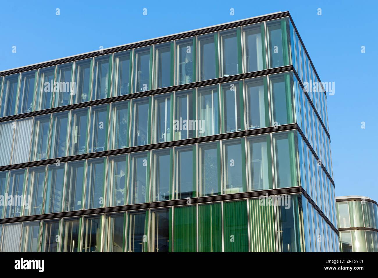 Modern office building in different shades of green Stock Photo - Alamy