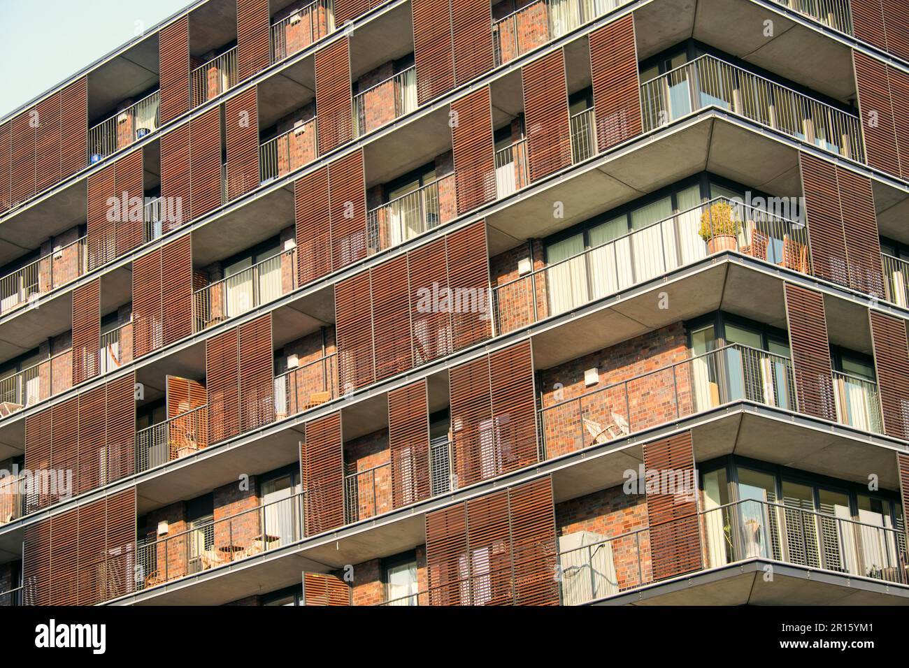 Detail of an apartment building with brown blinds Stock Photo - Alamy