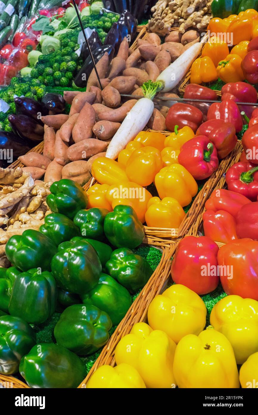 Different types of peppers at a market Stock Photo - Alamy