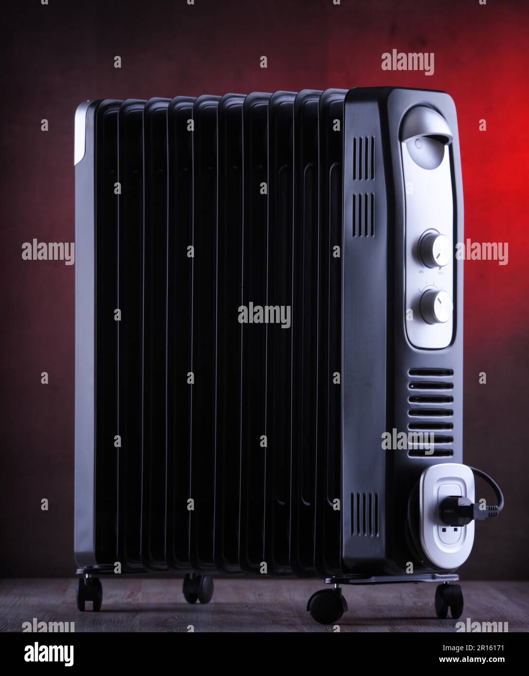 Electric liquid-filled oil heater for home use Stock Photo - Alamy