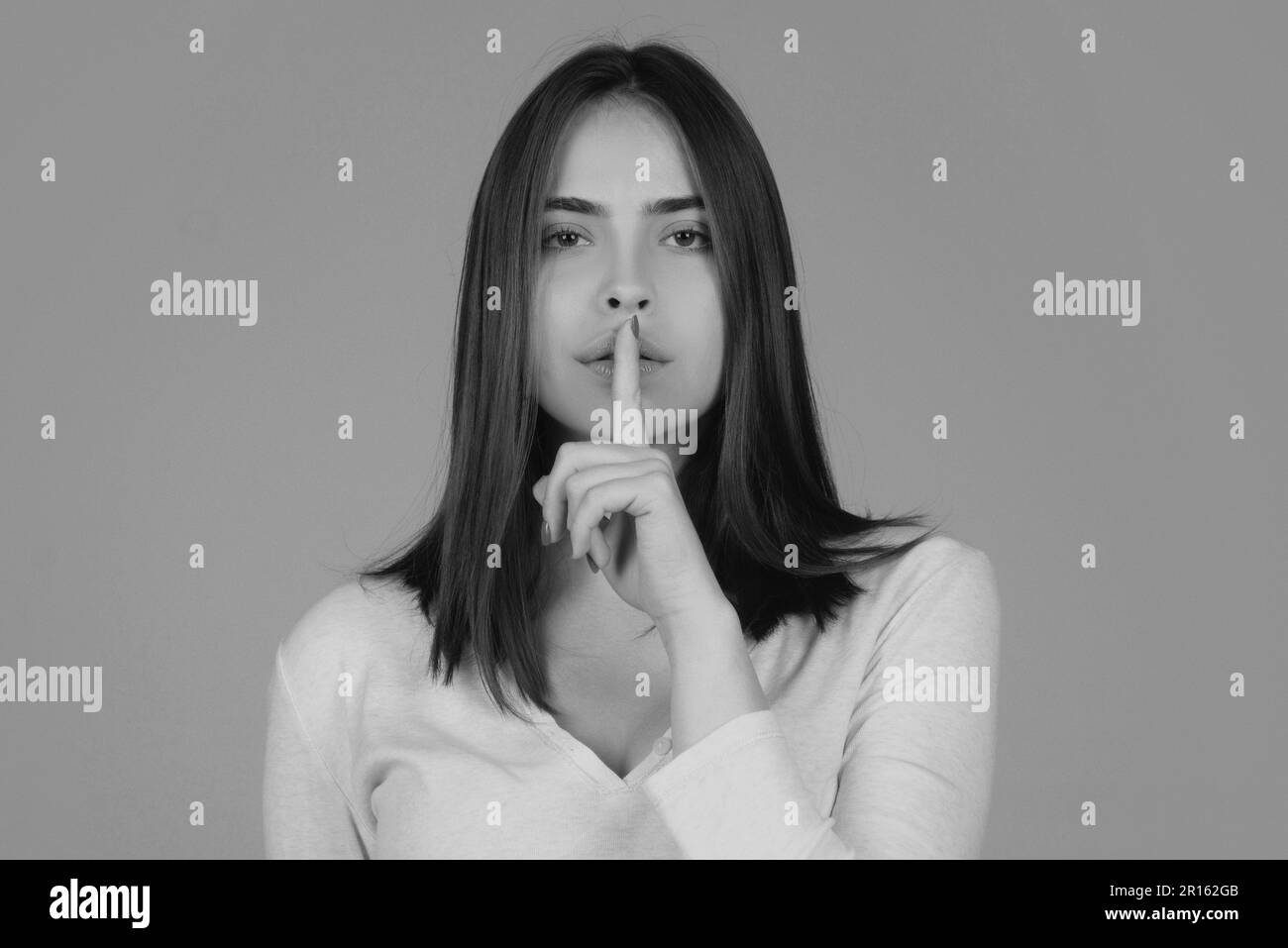 Shh finger Black and White Stock Photos & Images - Alamy