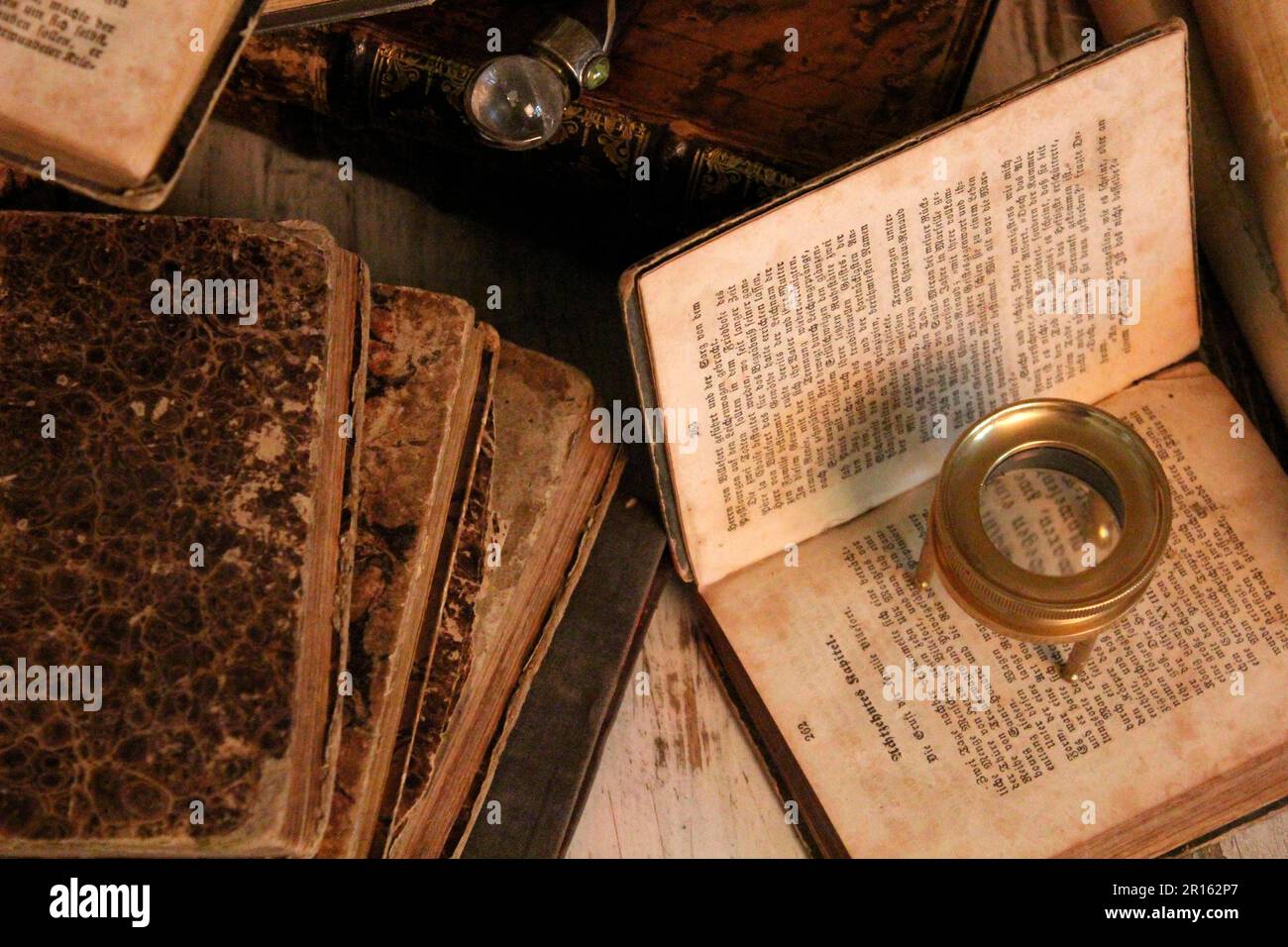 Book old magnifier hi-res stock photography and images - Alamy