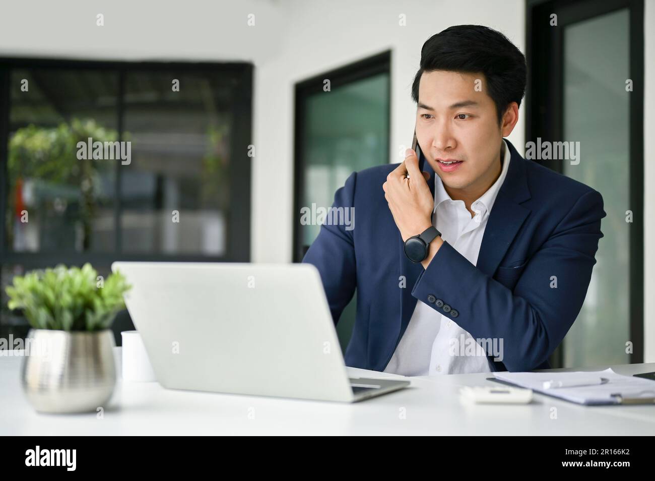 Smart and professional millennial Asian businessman or male CEO in ...