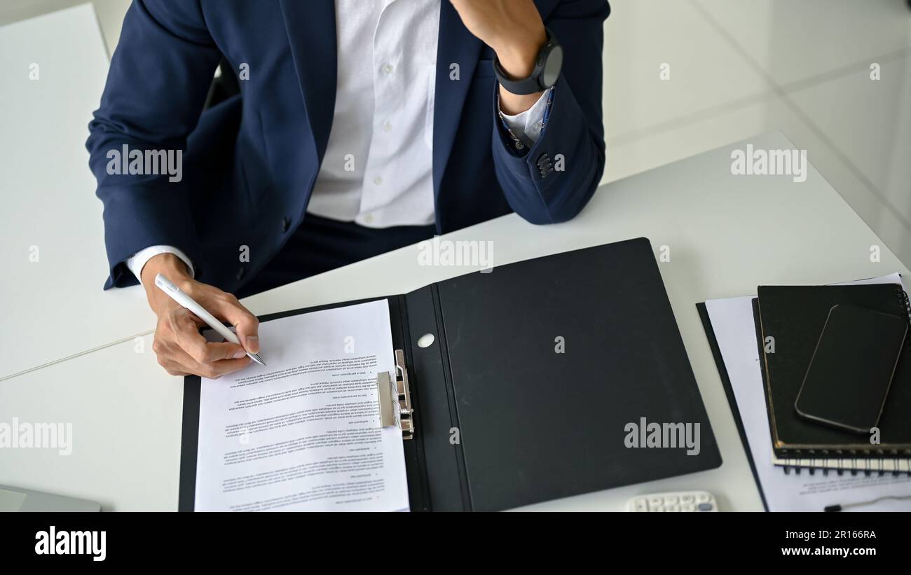 Image of a businessman hand signing documents hi-res stock photography ...