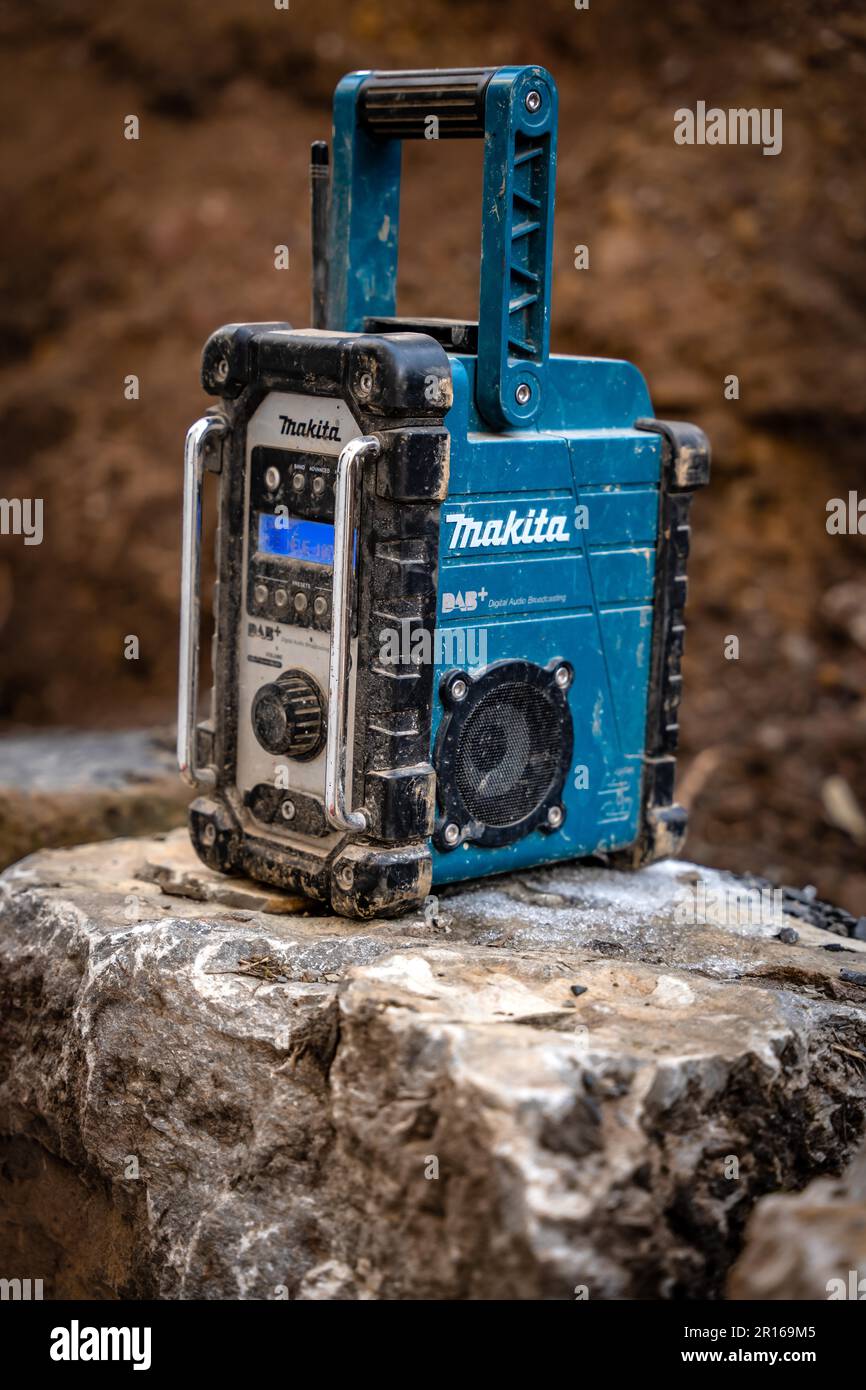 Dirty construction site radio on stone, Calw, Germany Stock Photo - Alamy