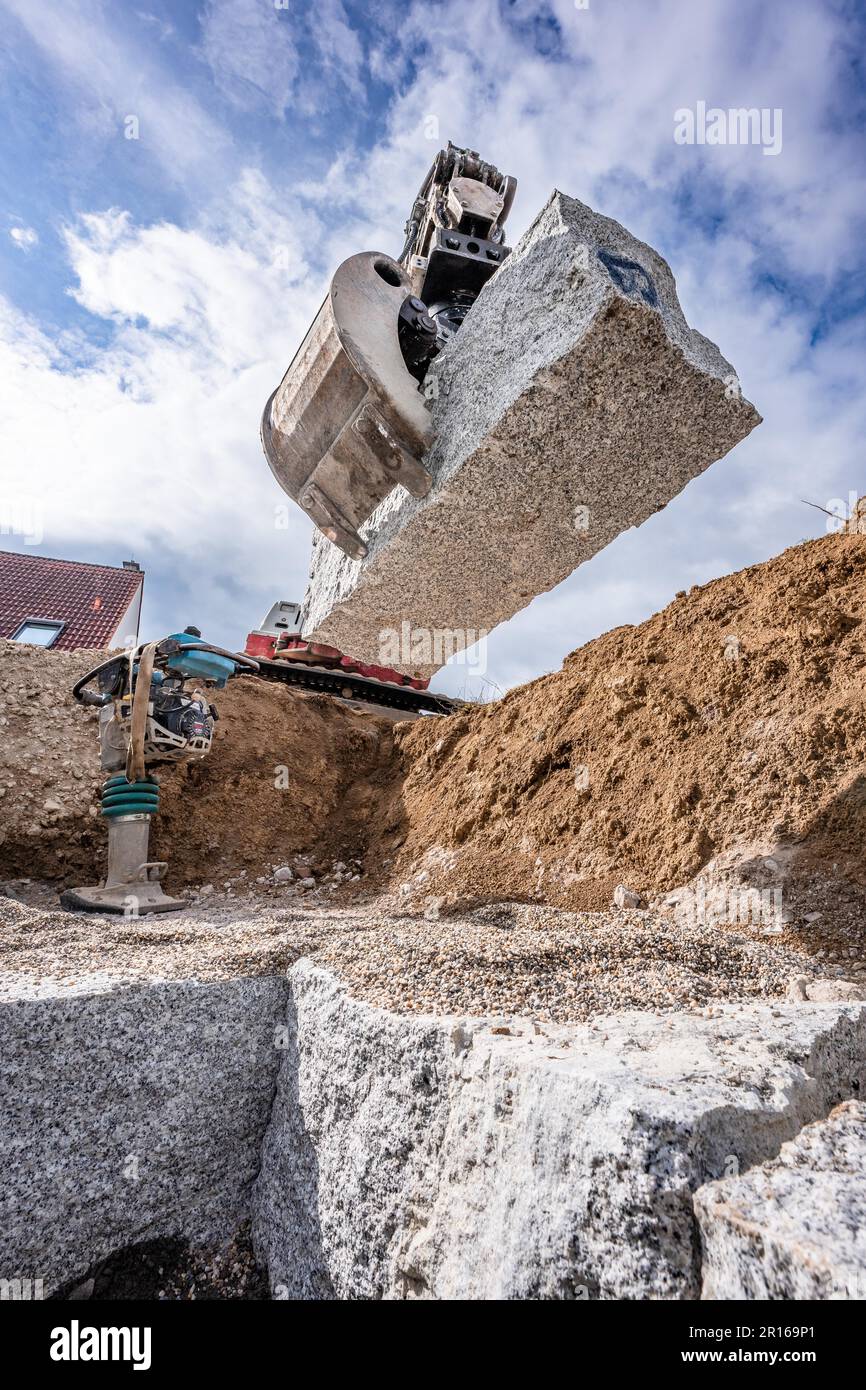 Excavator grab with stone on construction site, Calw, Germany Stock ...