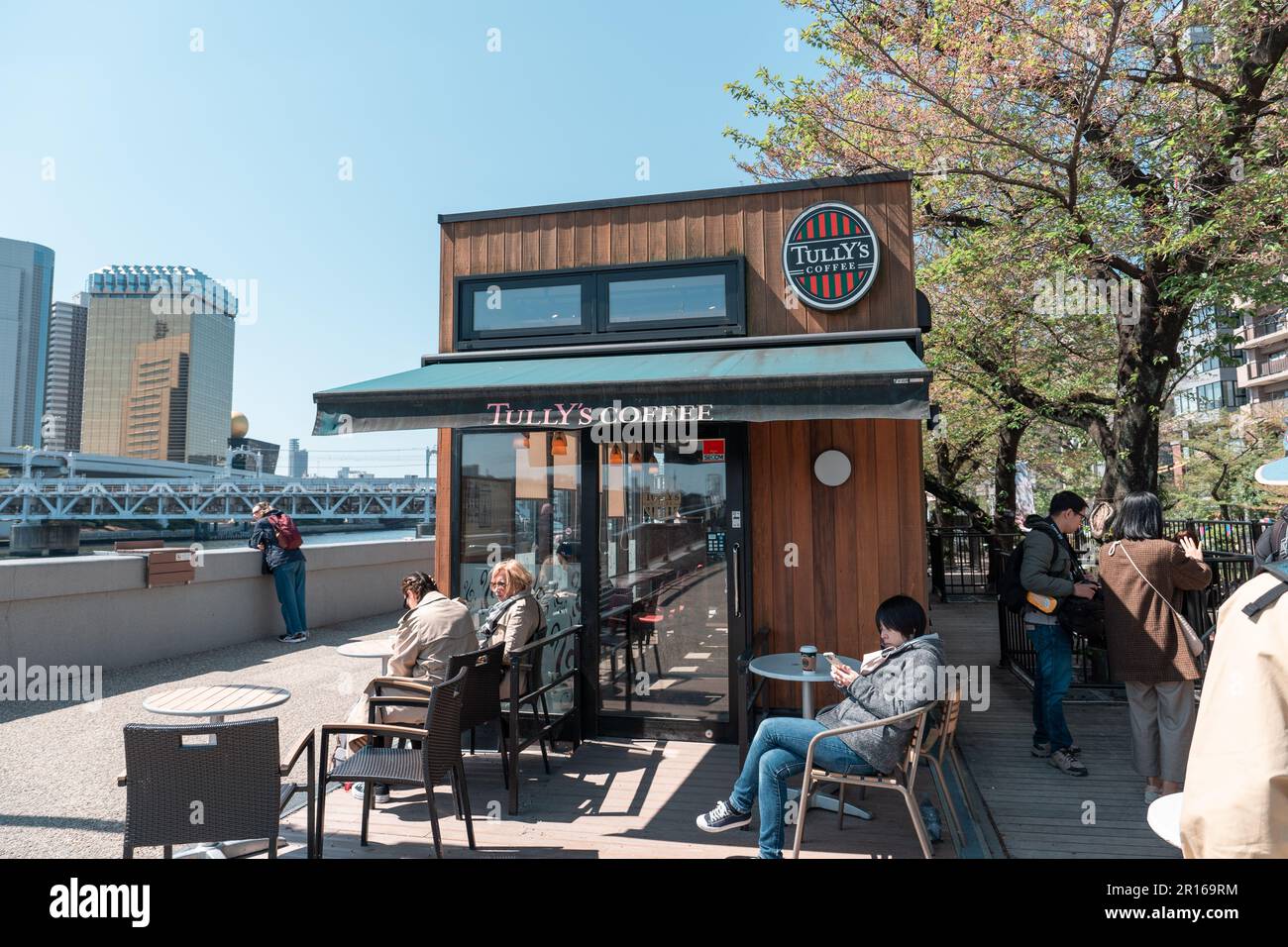 TOKYO, JAPAN - APRIL 9, 2023: People relaxing in Tully's coffee at ...