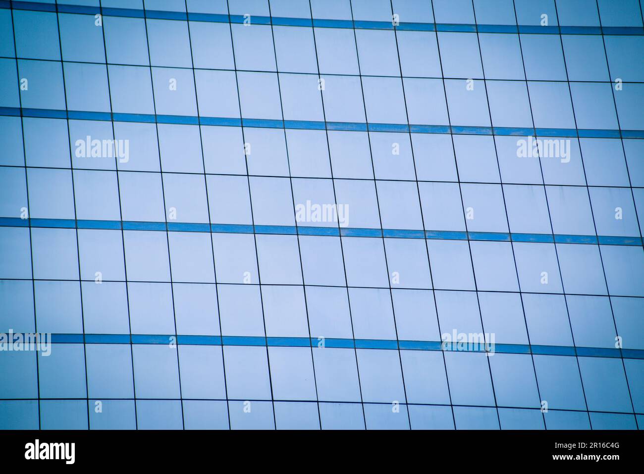 Blue glass windows of office building for background Stock Photo - Alamy