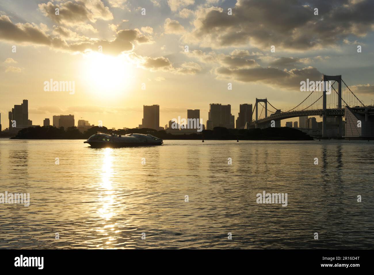 Sunset, buildings in Central Tokyo and Rainbow Bridge Stock Photo - Alamy