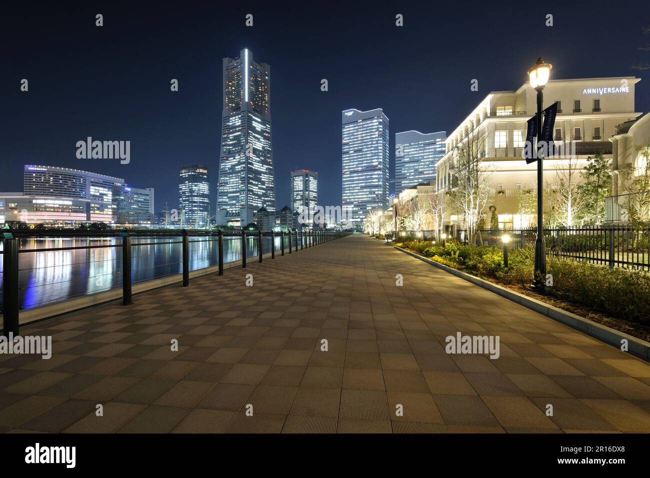 The stone pavement at night and lights of Minato Mirai buildings Stock ...