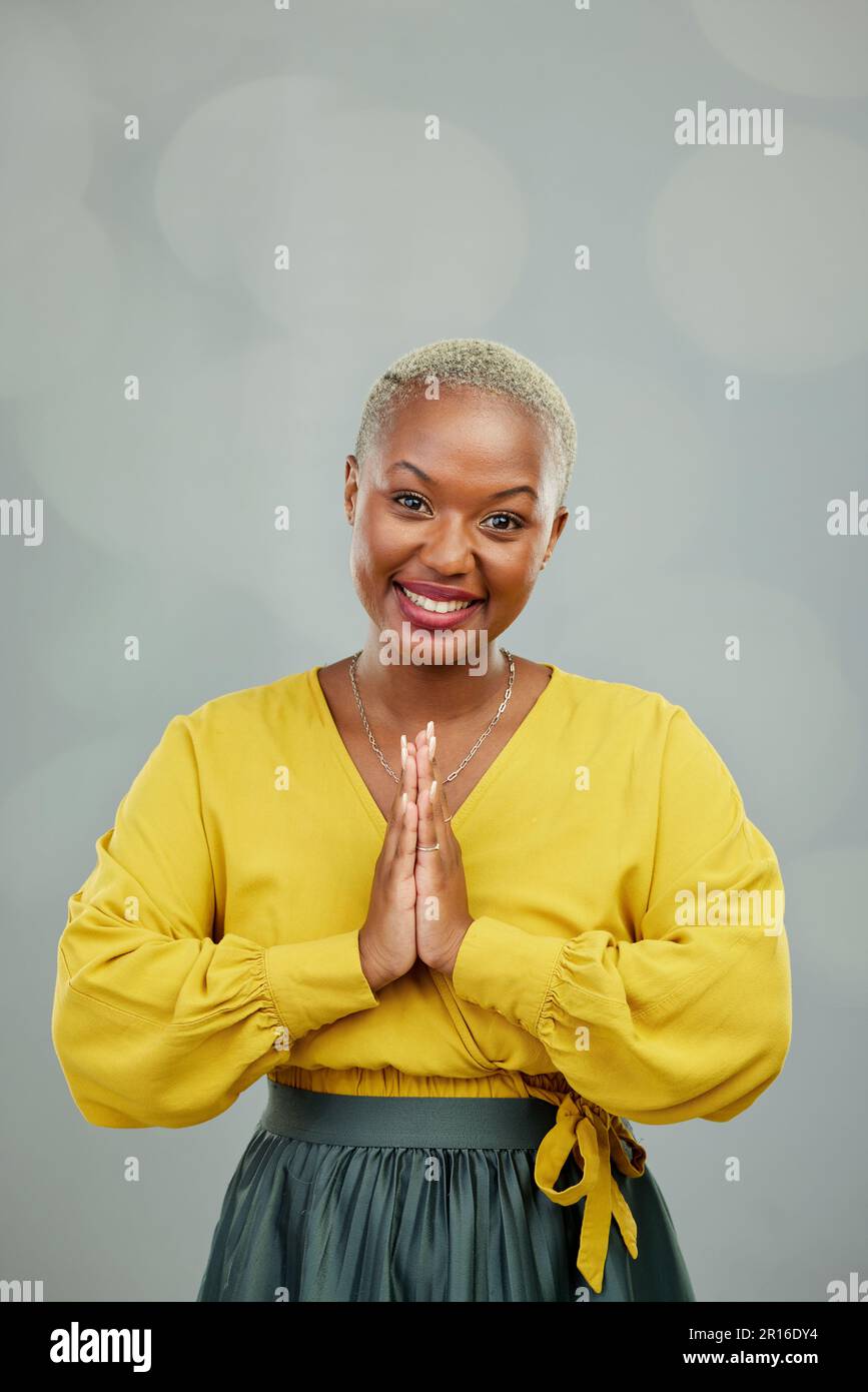 Praying hands, thank you and portrait of happy woman in studio with ...