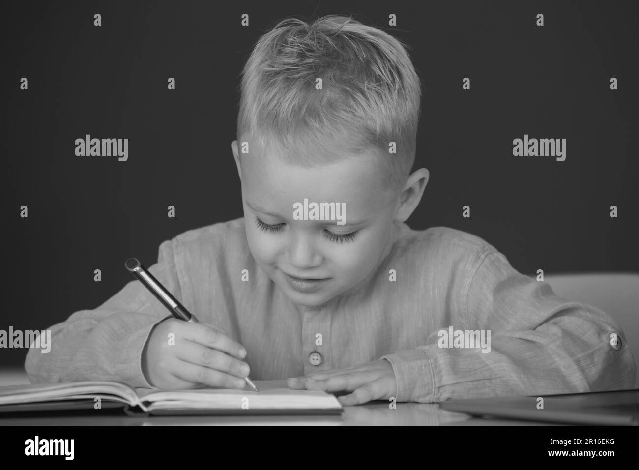 Student writing on chalkboard Black and White Stock Photos & Images - Alamy