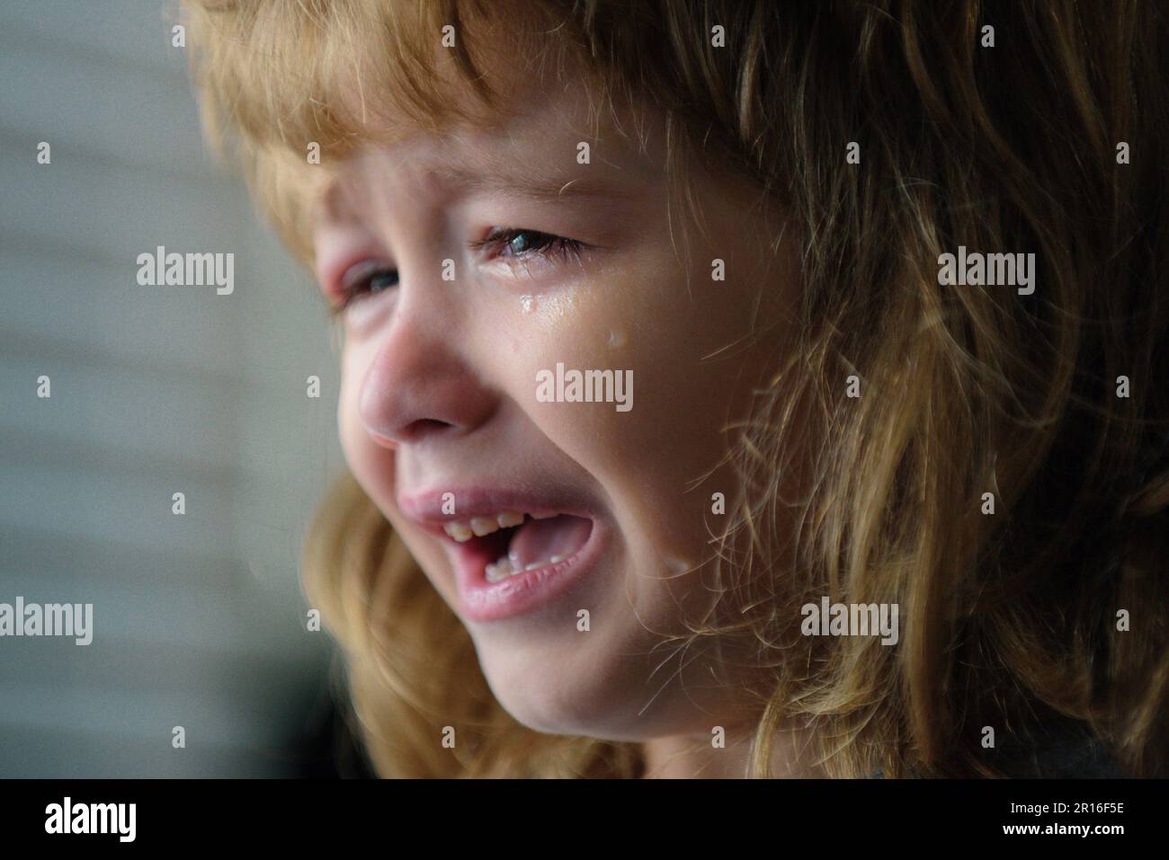 Crying Little Boy. Sad Child at Home Stock Photo - Alamy