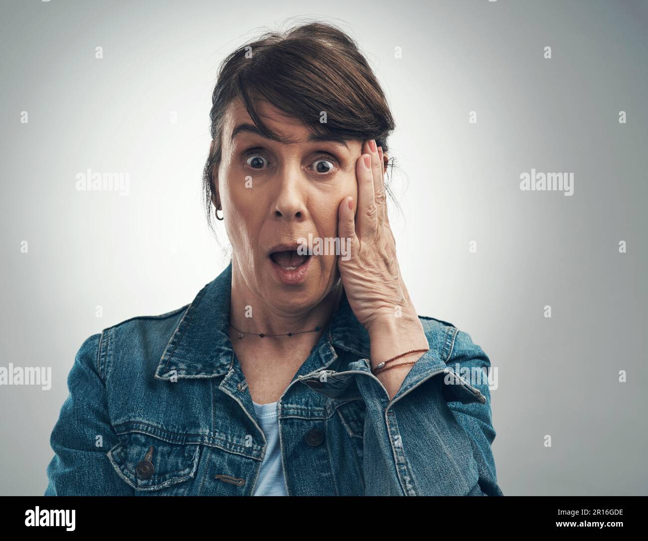 This has come as a big shock to me. Studio portrait of a senior woman ...