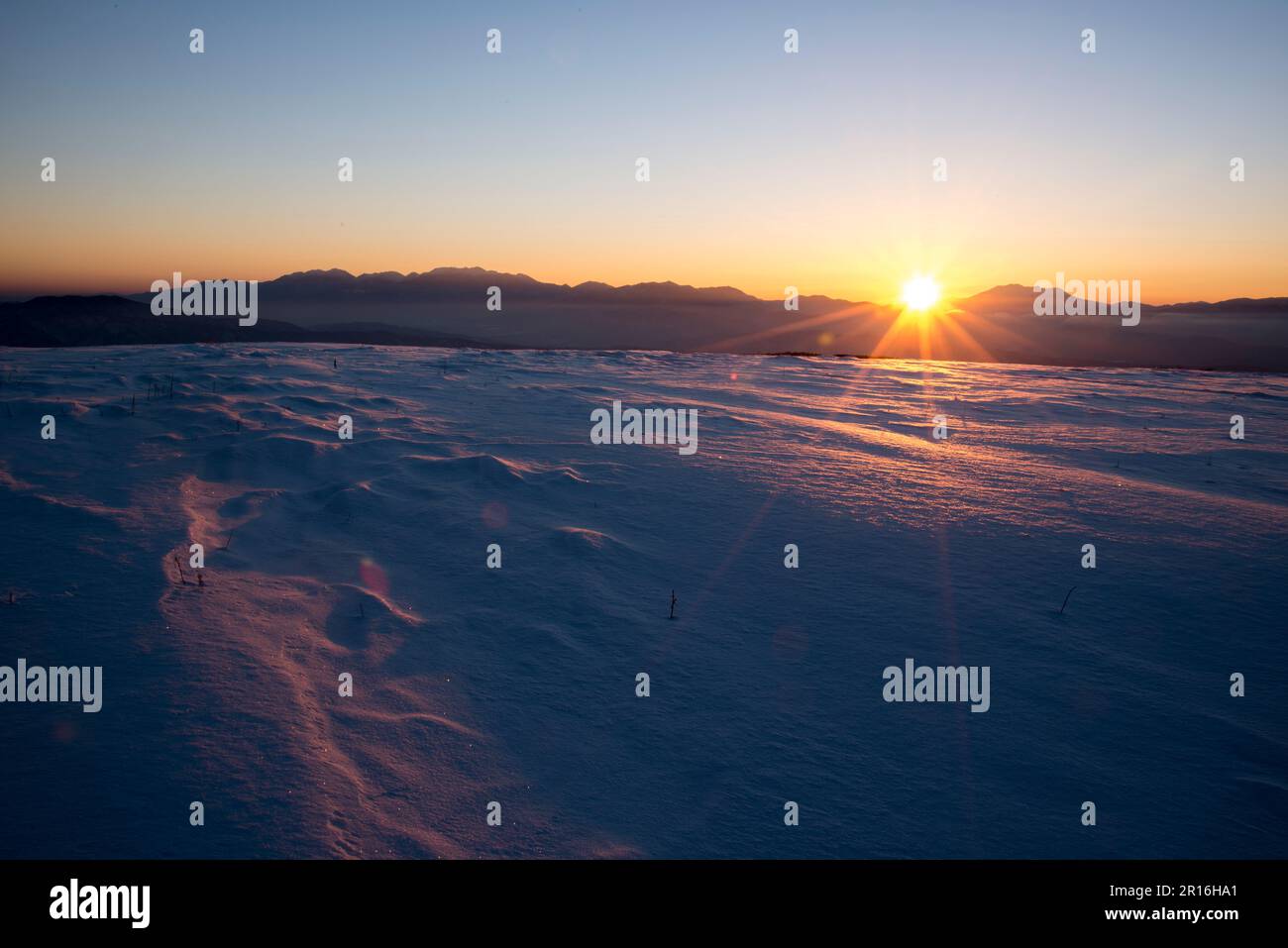 The Middle Alps and the sunset from a snowfield on the Kirigaminekogen ...