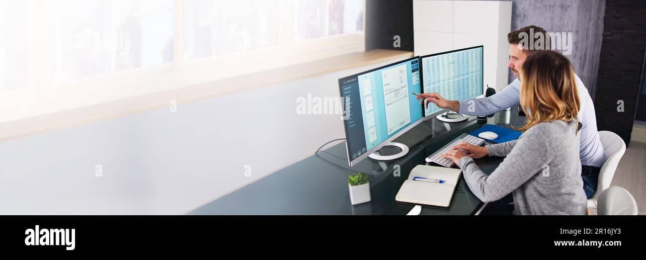 Spreadsheet And Electronic Invoice On Multiple Computer Screens Stock ...